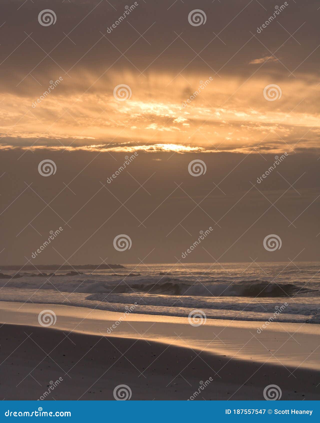 Sun Rays Shining through the Clouds at the Beach. Stock Image - Image ...
