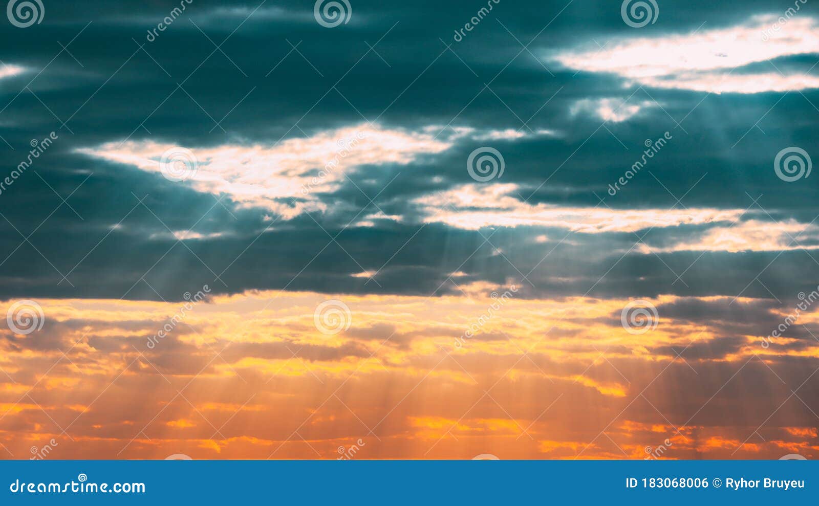 Sun Rays Shining through Cloudy Sky with Fluffy Clouds. Sunset Sky ...
