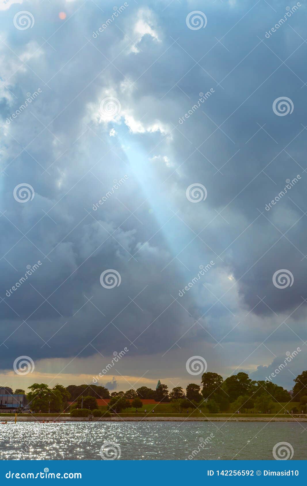 Sun Rays Shining through Dark Cloudy Sky Stock Photo - Image of ...