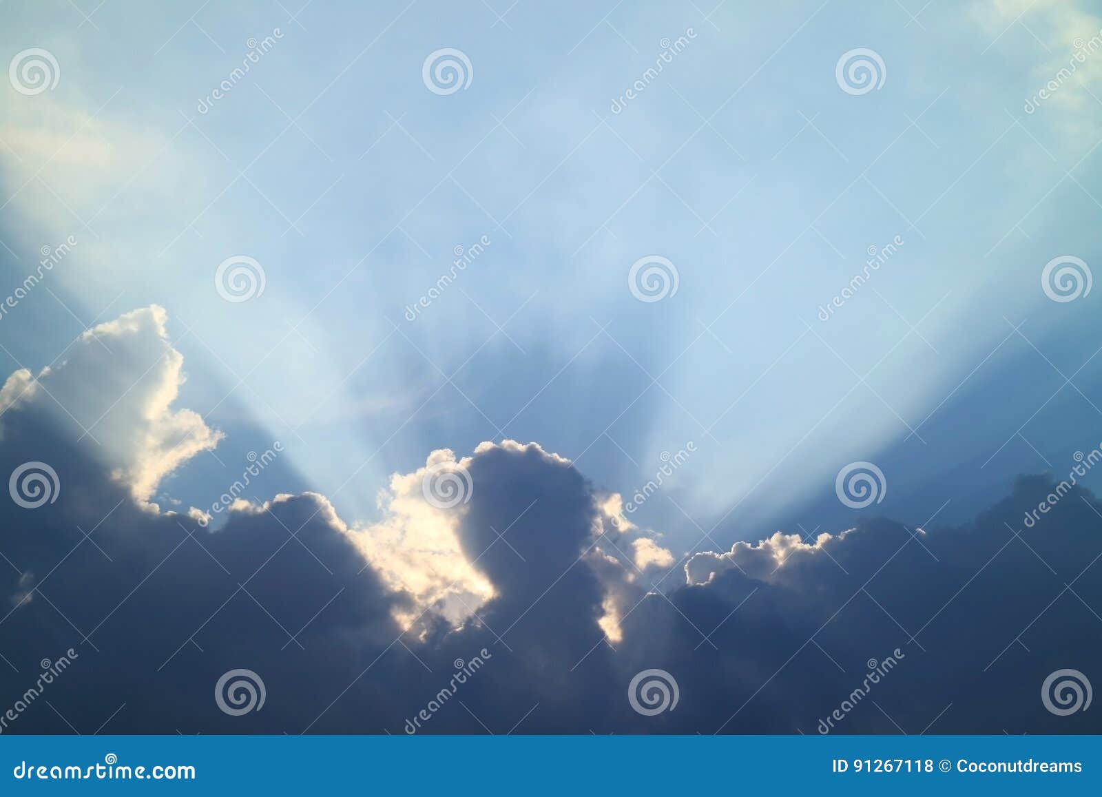 Sun Rays Shining through the Gray Clouds on Blue Sky Stock Photo ...