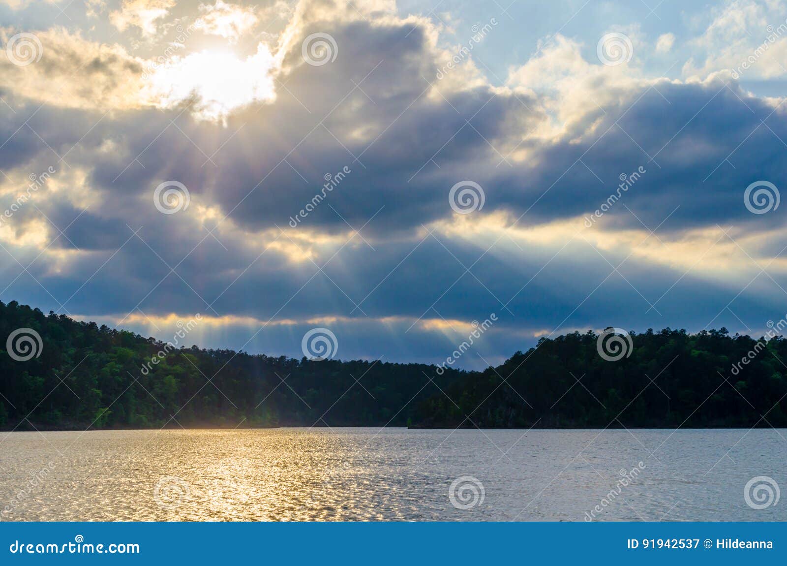 Sun Rays Streaming Thru Dramatic Clouds with Lake View. Stock Image ...