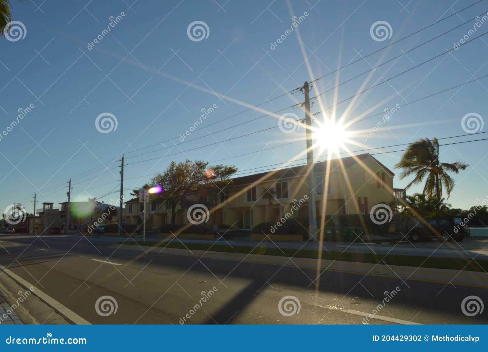 Sun rays on the street stock photo. Image of lighting - 204429302