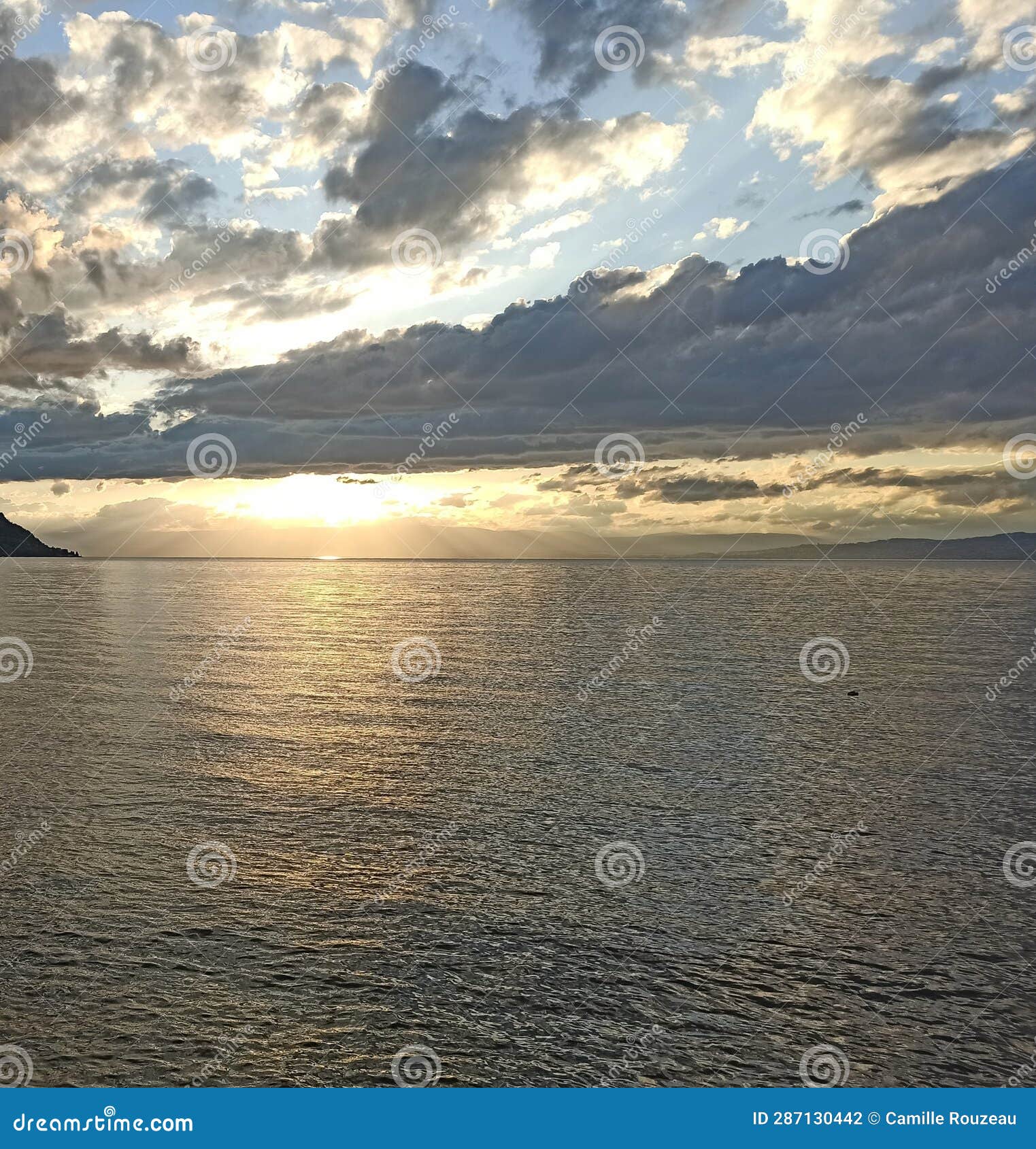 Sun Rays in the Sunset Over the Lake Stock Photo - Image of people ...
