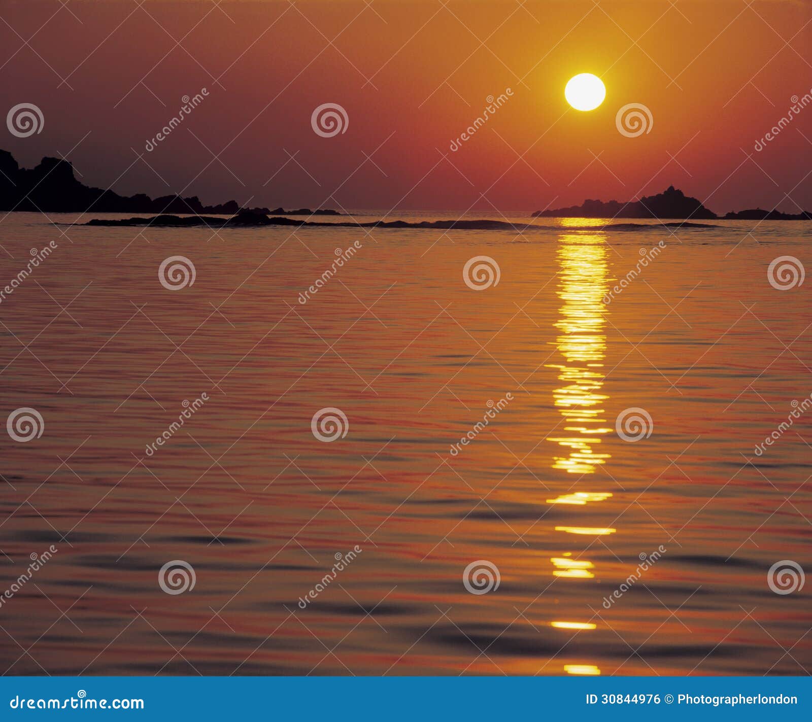 Sun Reflecting on Water at Sunset Stock Photo - Image of idyllic, quiet ...