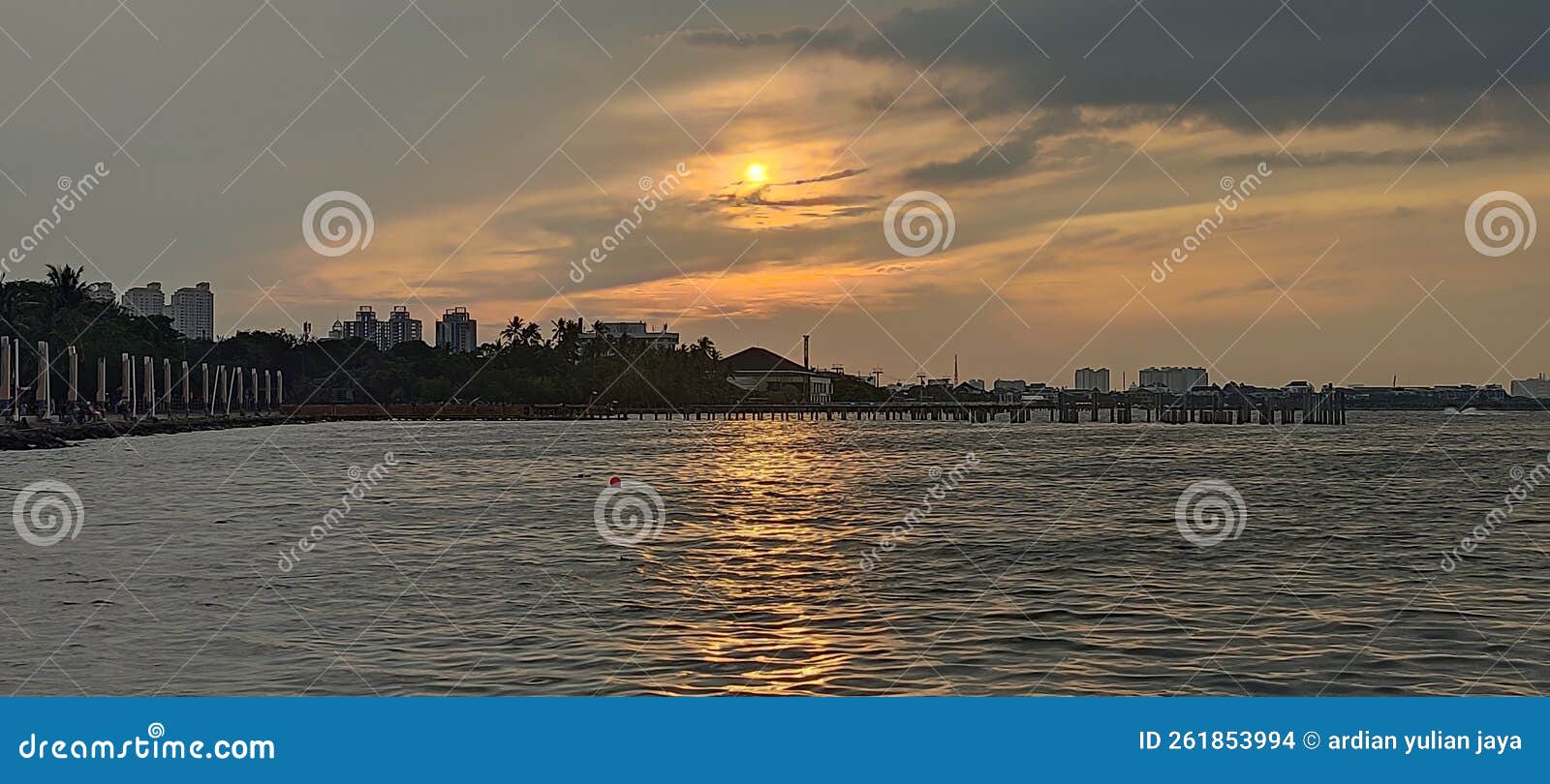 Sun rises ancol beach stock photo. Image of horizon - 261853994