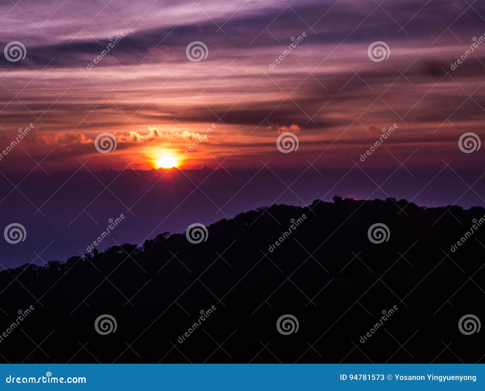 The Sun Rises Behind the Horizontal Cloud with the Shadow of the Stock ...