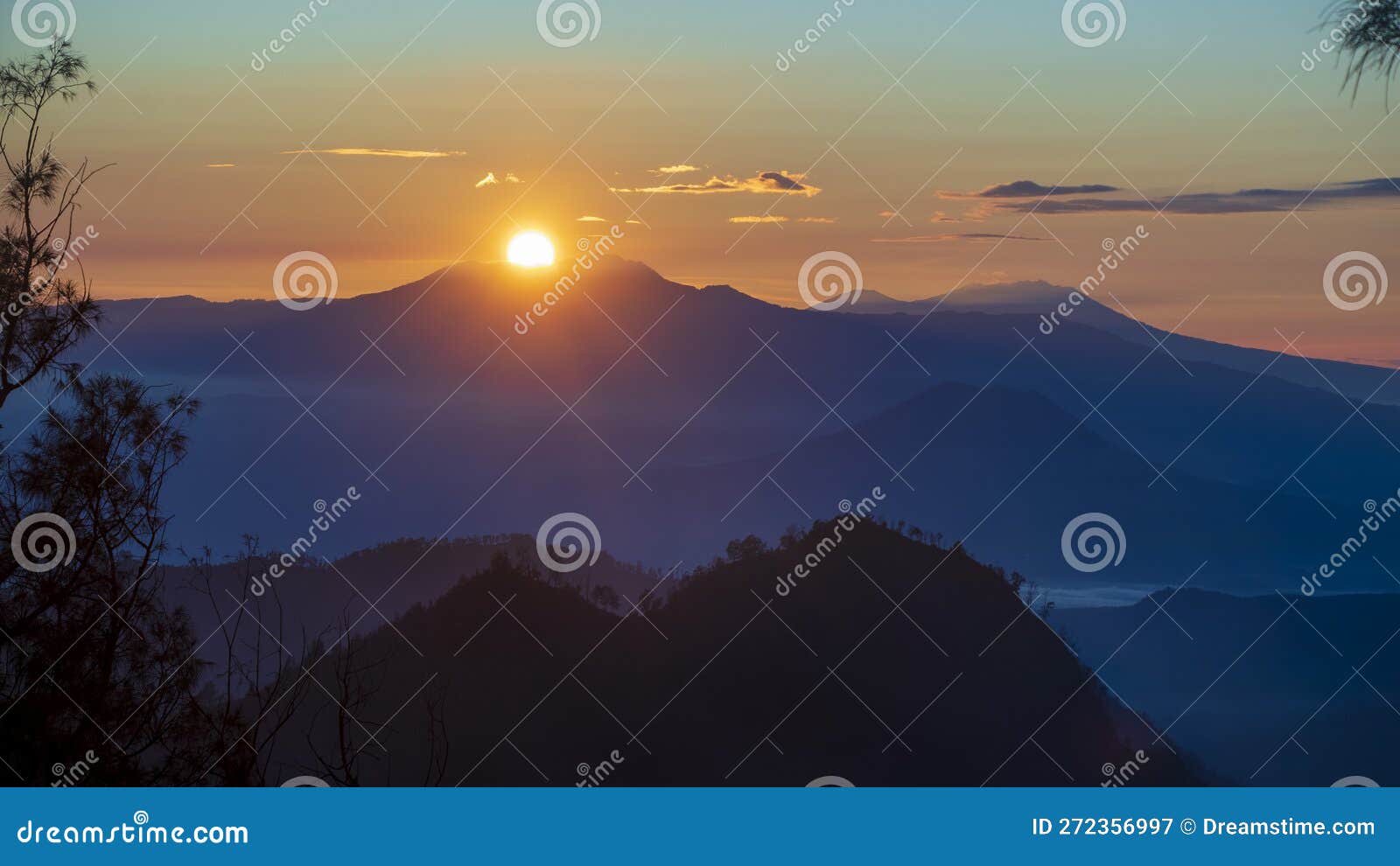 The Sun Rises Behind Mount Arjuna Stock Image - Image of sunset, hill ...