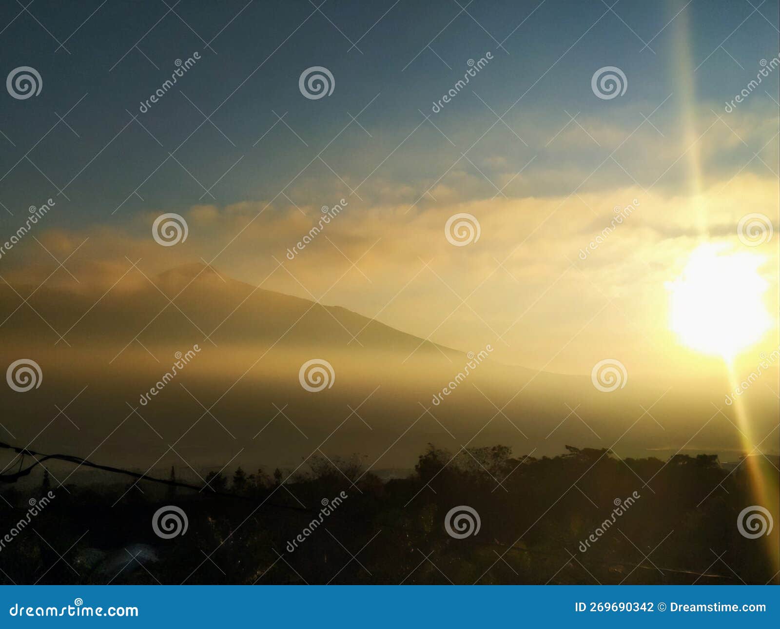 The Sun Rises from Behind the Mountains Stock Photo - Image of sunrise ...