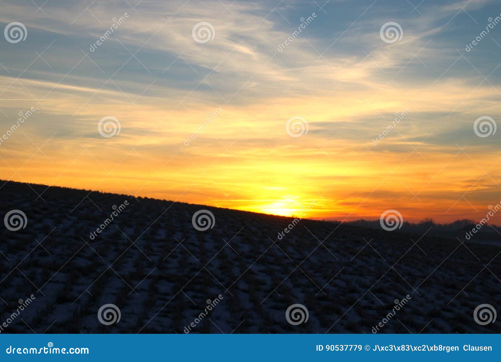 The Sun Rises Behind a Small Hill Stock Image - Image of sunset, winter ...