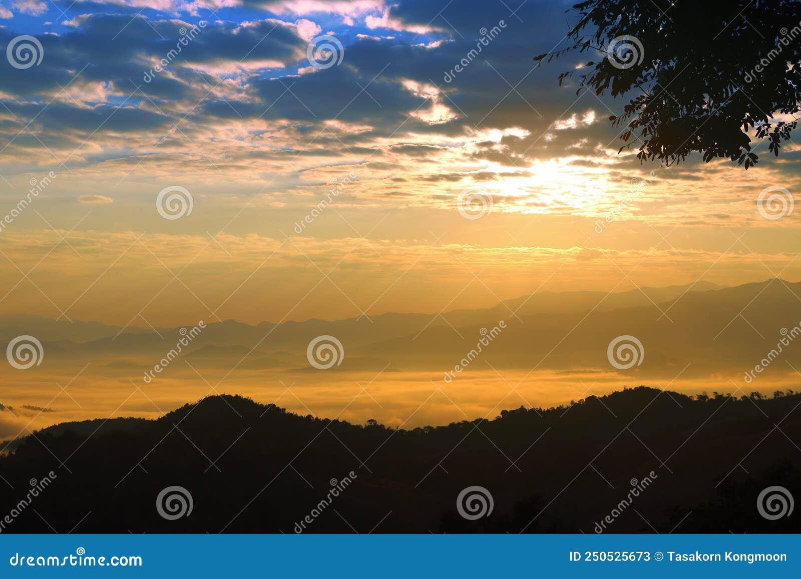 Sun Rises through Clouds with Fog on the Mountain Stock Image - Image ...