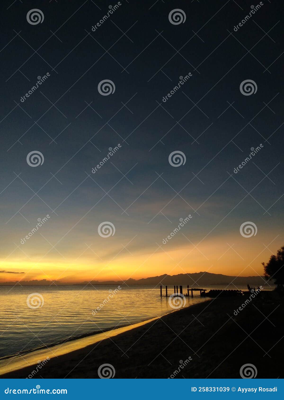 The Sun Rises from the East of the Quiet and Calm Beach Stock Image ...