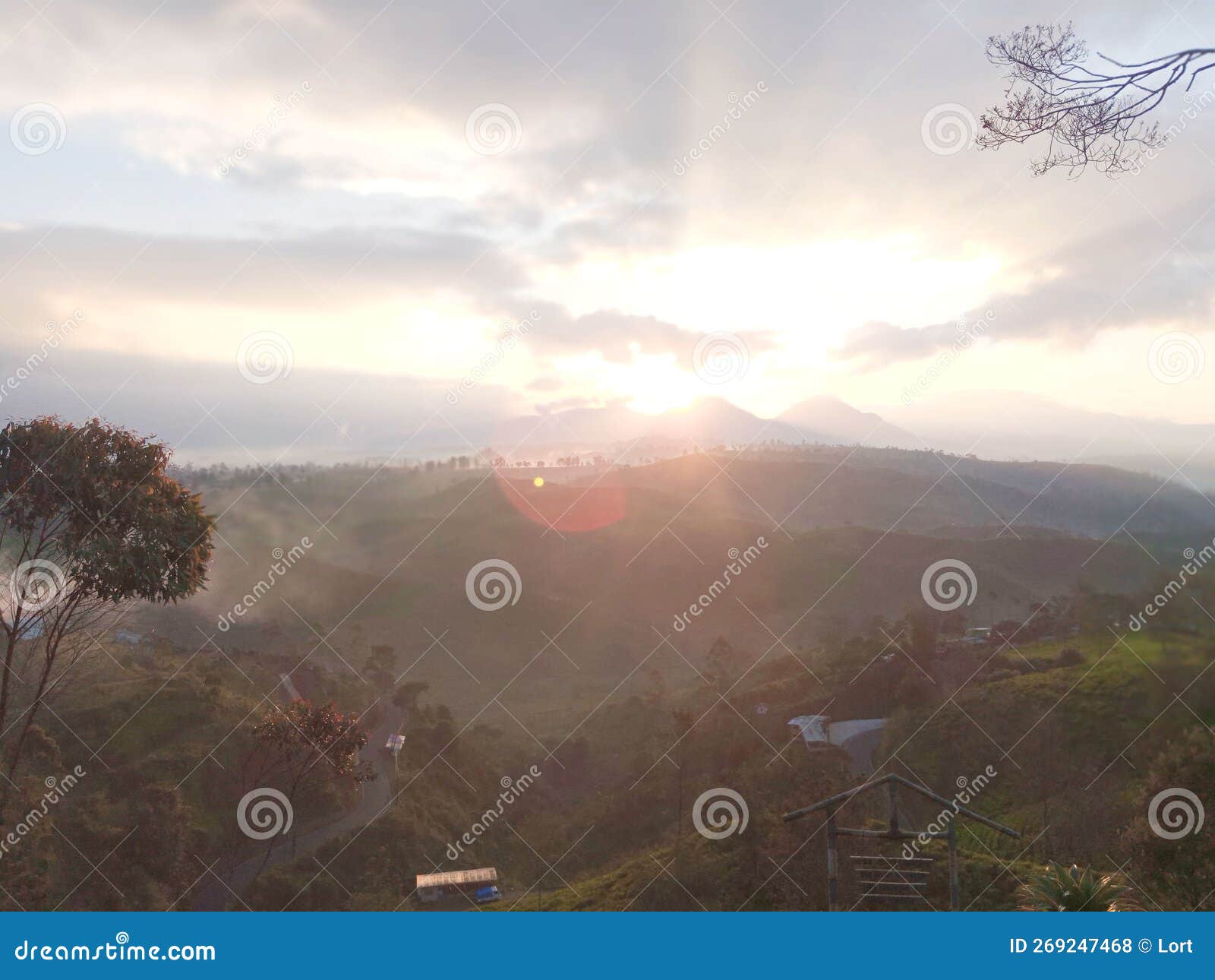 The Sun Rising from the Mountains Illuminates Village Stock Photo ...
