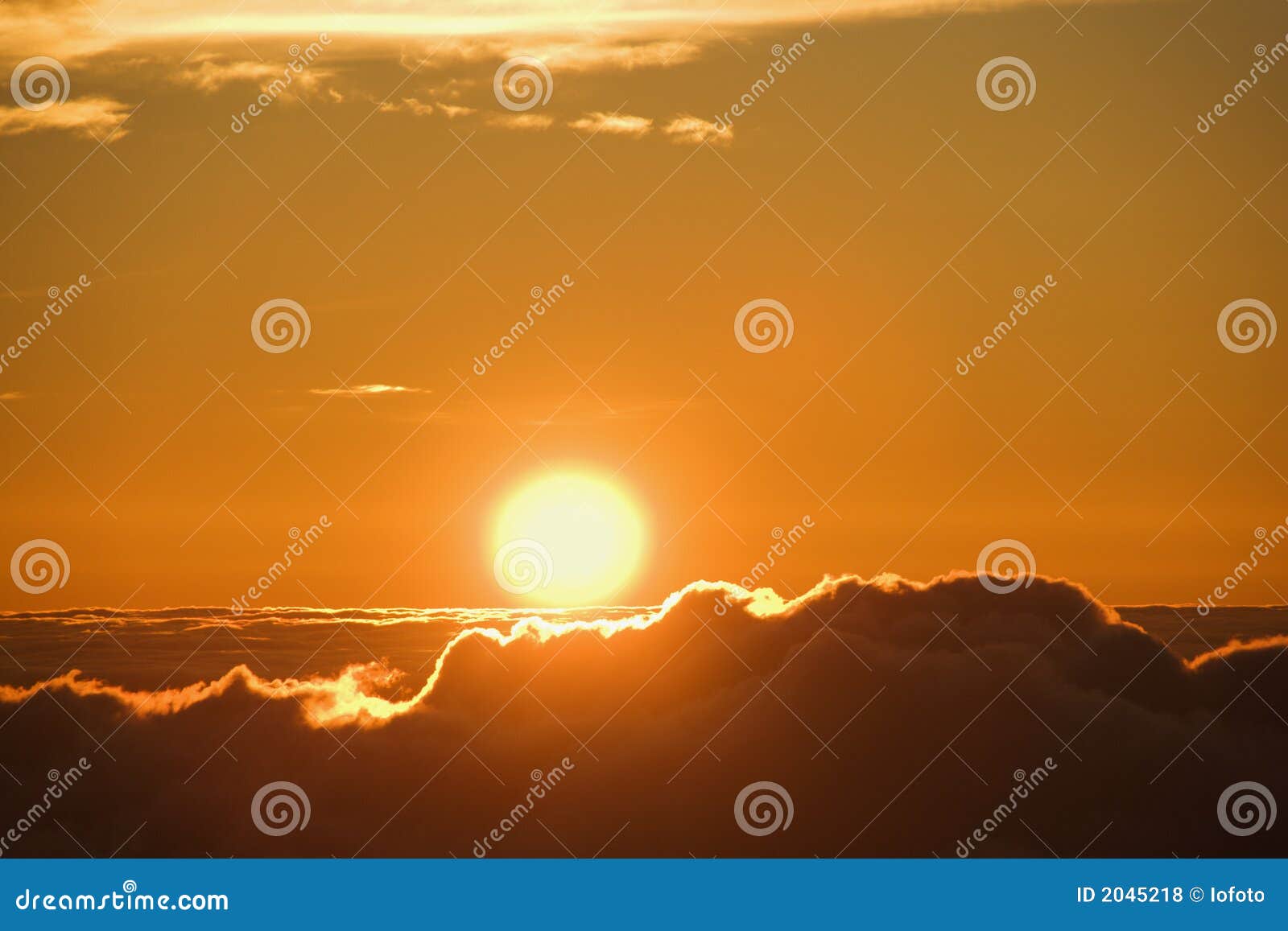 Sun rising over clouds. stock photo. Image of sunrise - 2045218