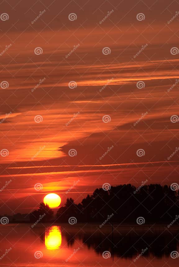 Sun rising over lake stock photo. Image of sunrise, nature - 7970350