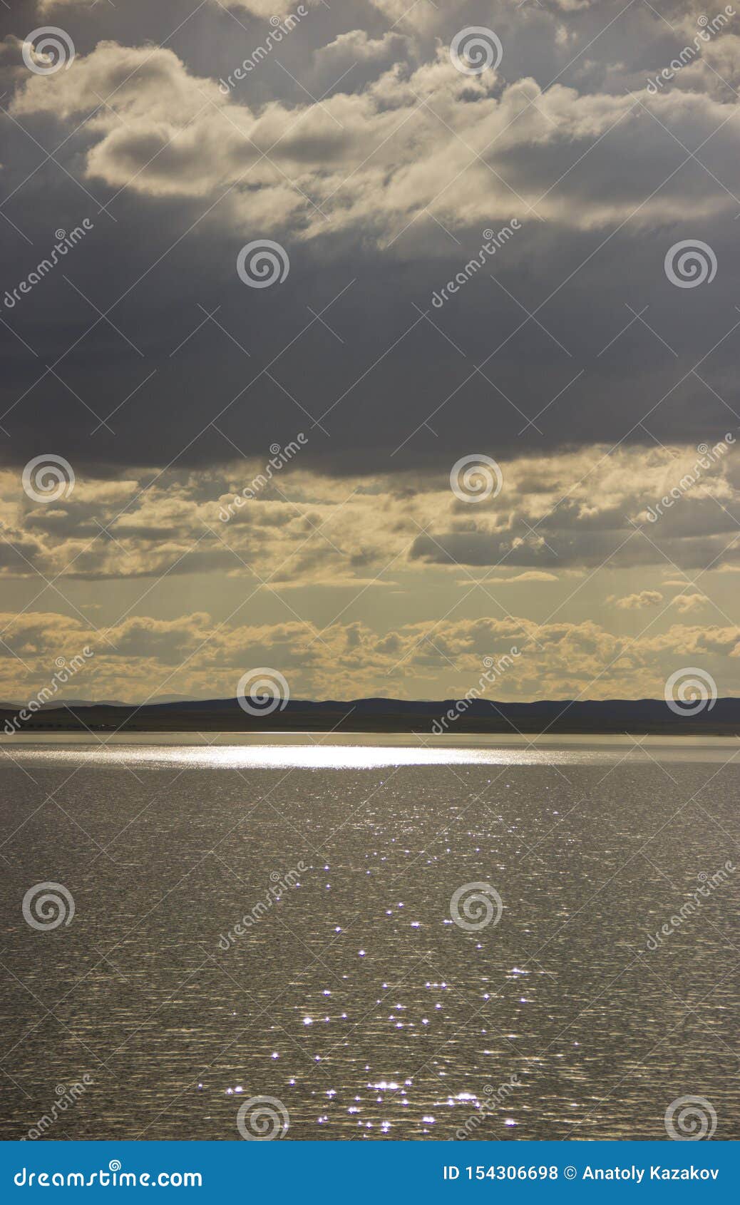 The Sun`s Rays Make Their Way through the Clouds and Illuminate the ...