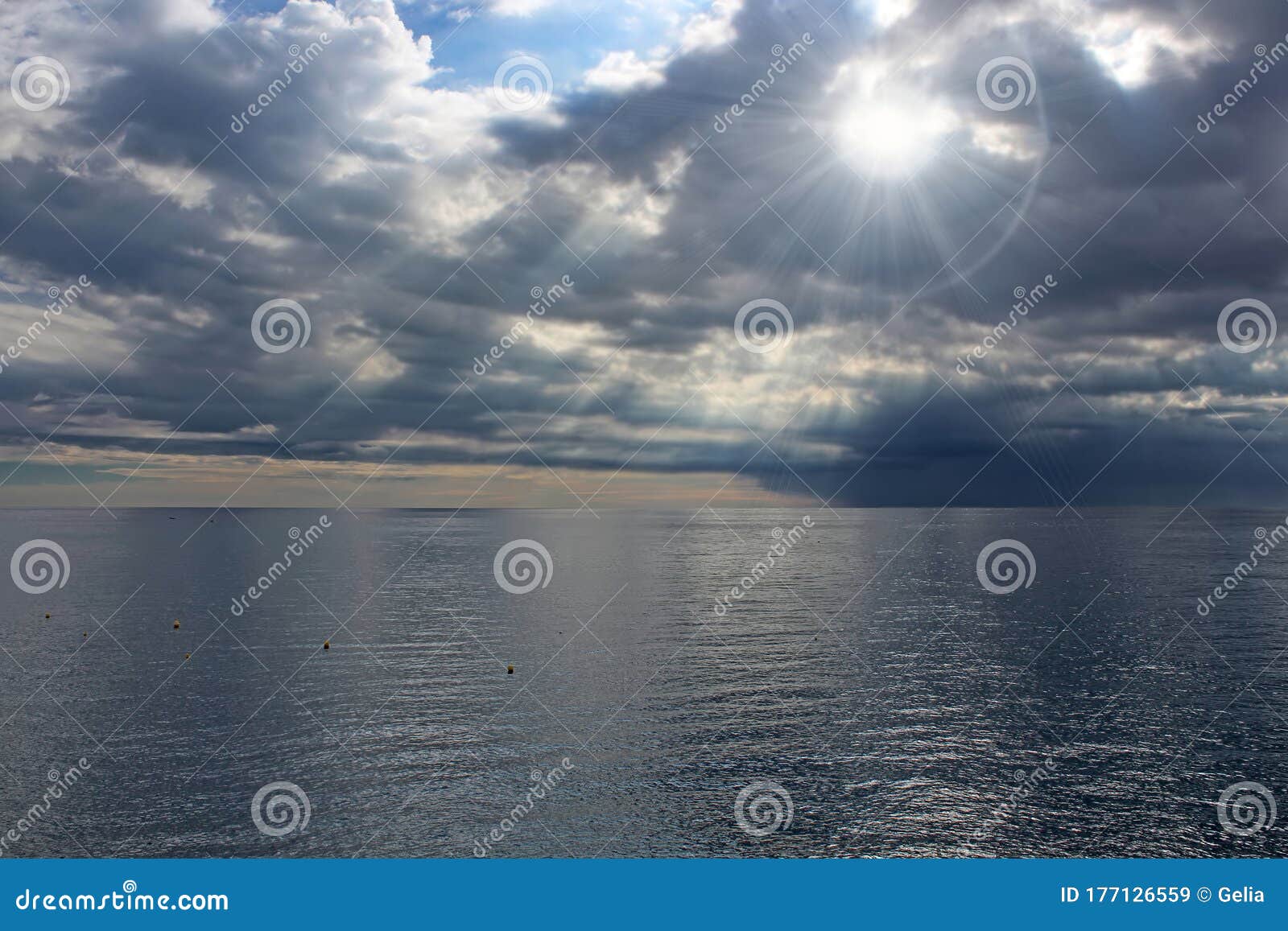 Sun Rays Passing through the Storm Clouds Over the Sea Stock Image ...