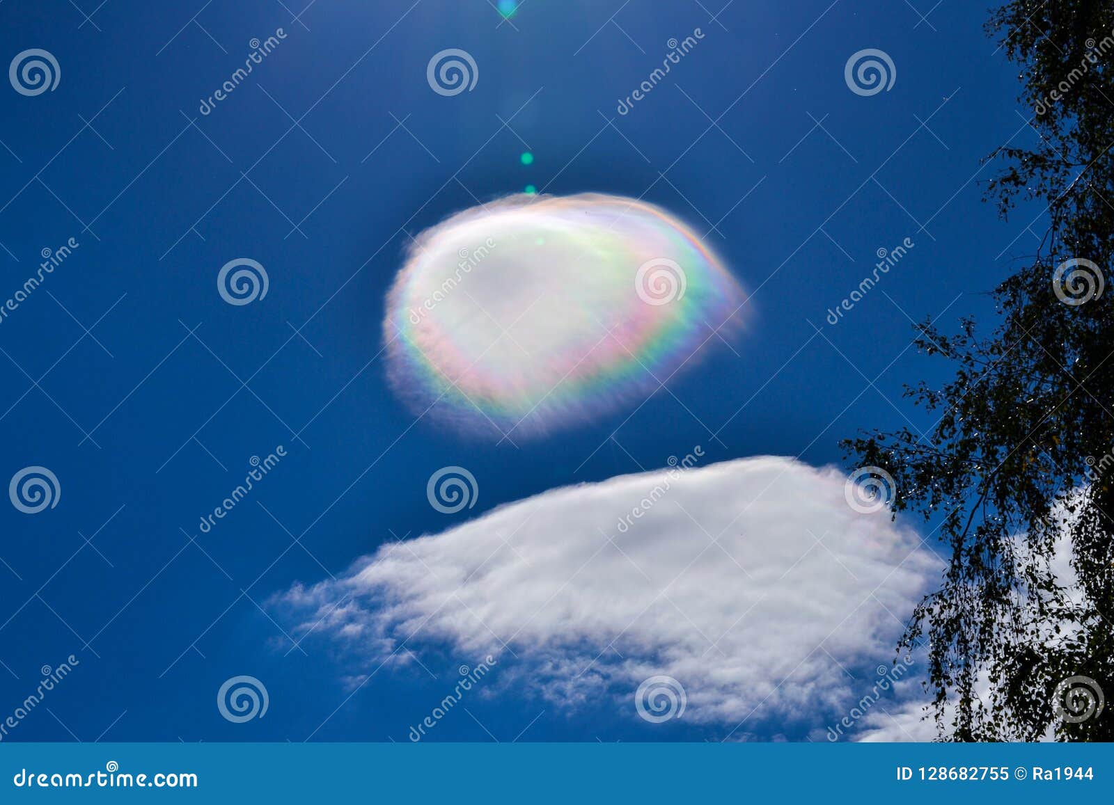 Sun`s Rays are Refracted in the Cloud. Rainbow in the Cloud. Stock ...