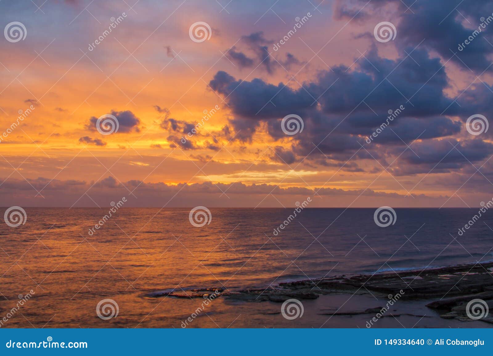 A sun set over the sea stock photo. Image of beach, season - 149334640