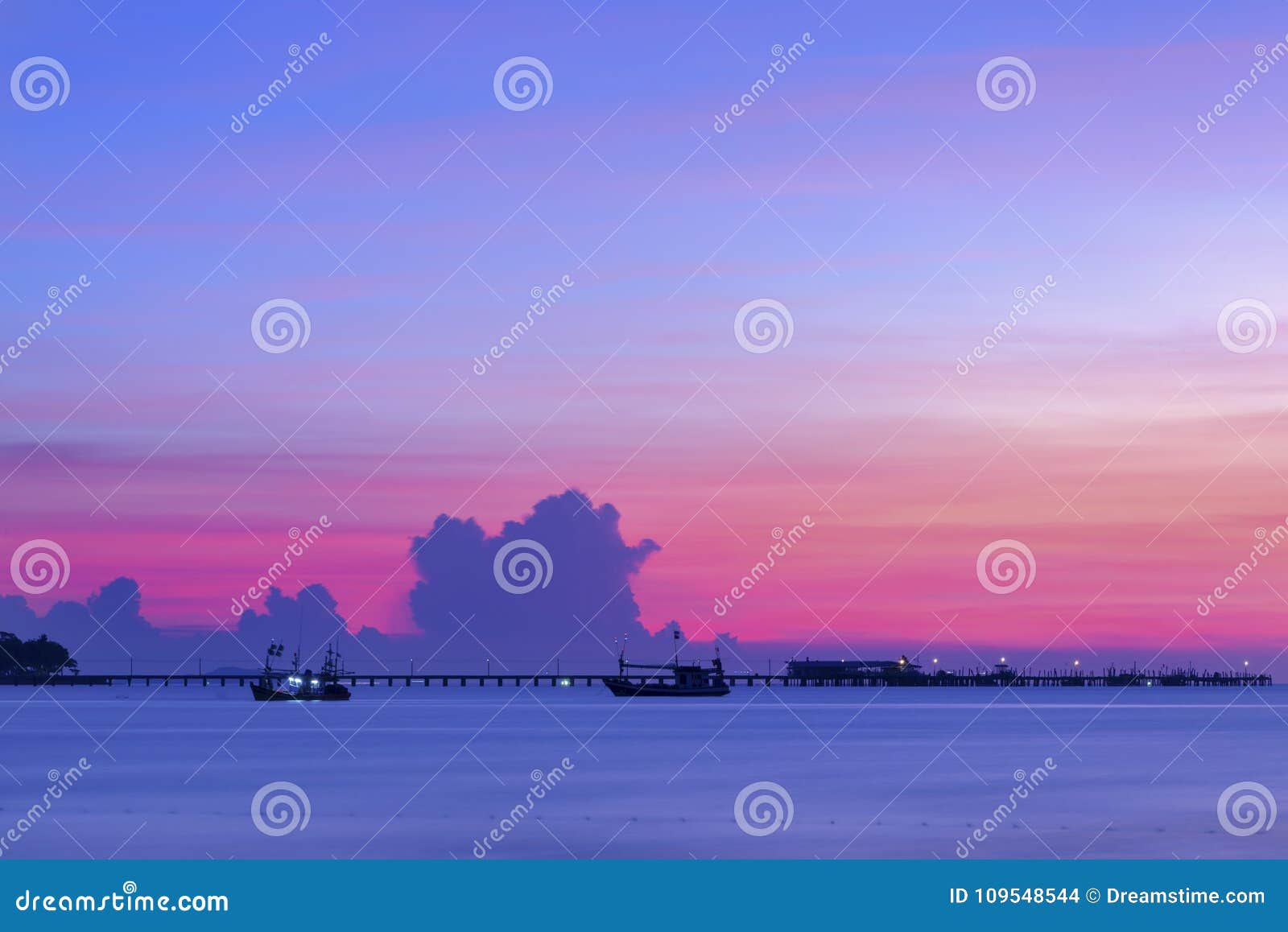 The Sun Sets Behind a Little Jetty Stock Photo - Image of seascape ...