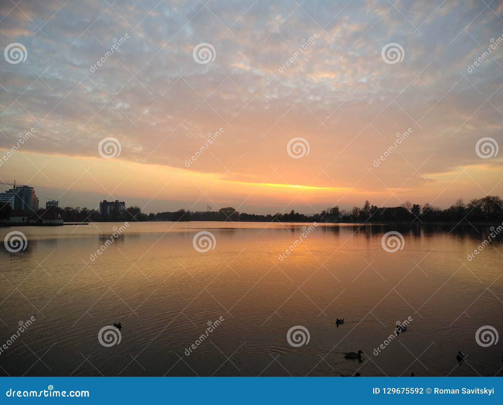 The Sun Sets Over the Evening Lake. Stock Photo - Image of evening ...