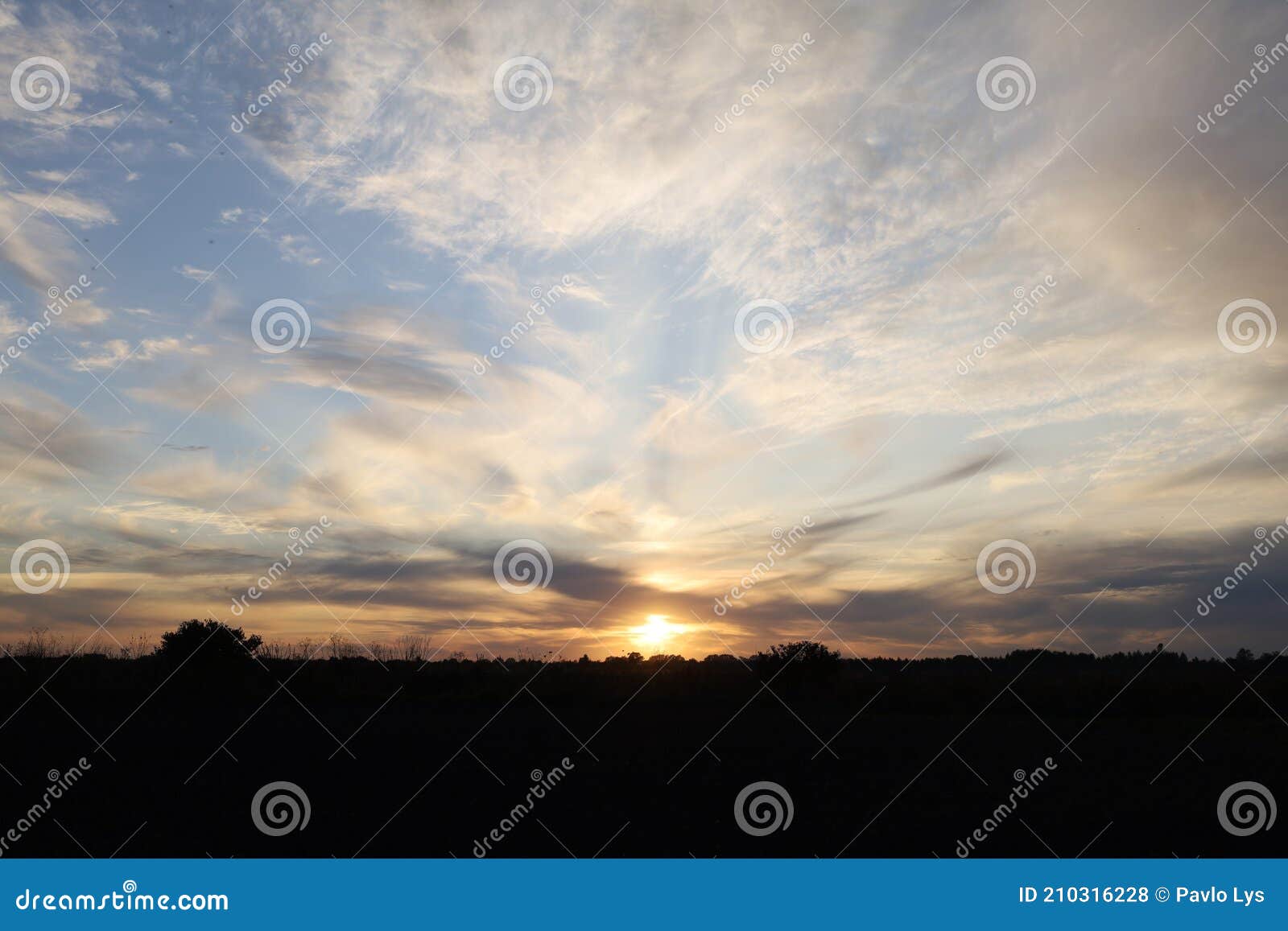 The Sun Sets and Translucent Clouds Stock Photo - Image of luminosity ...