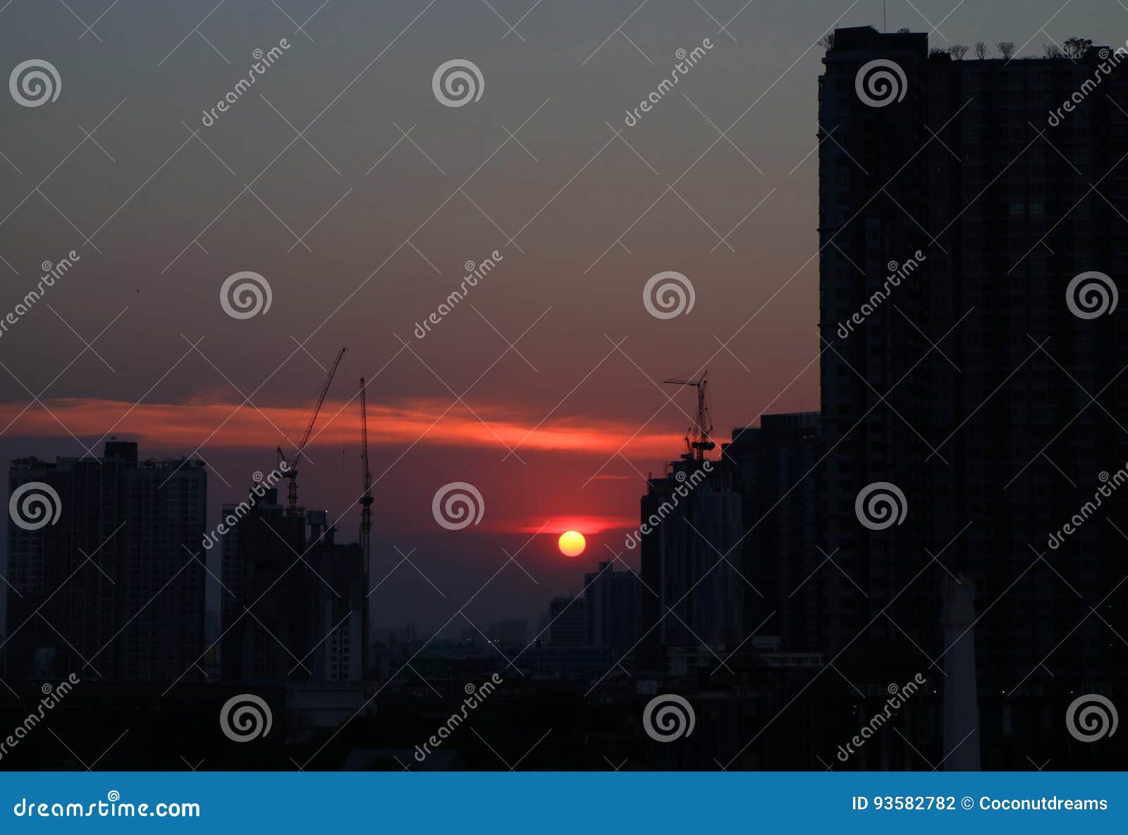 The Sun Setting Amongst the Skyscraper and Construction Buildings of ...