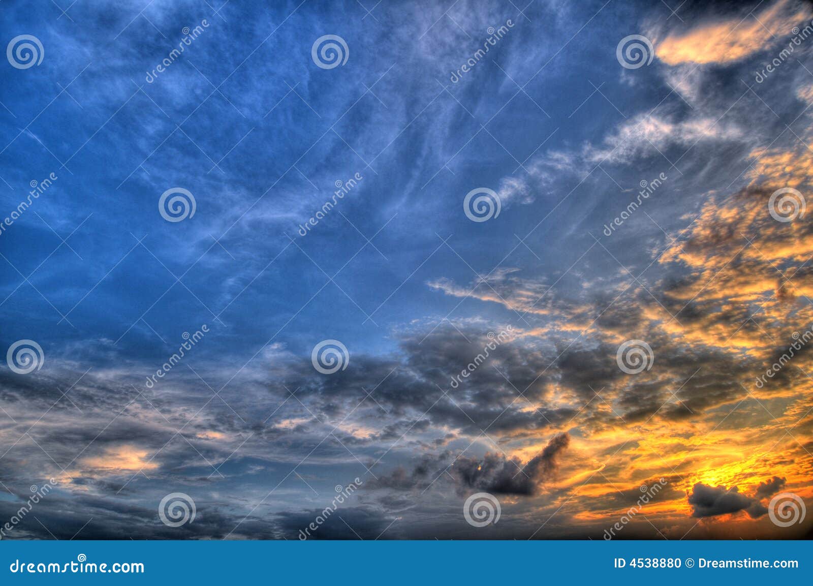 Sun Setting Behind the Blue Skies Stock Photo - Image of nature, sunset ...