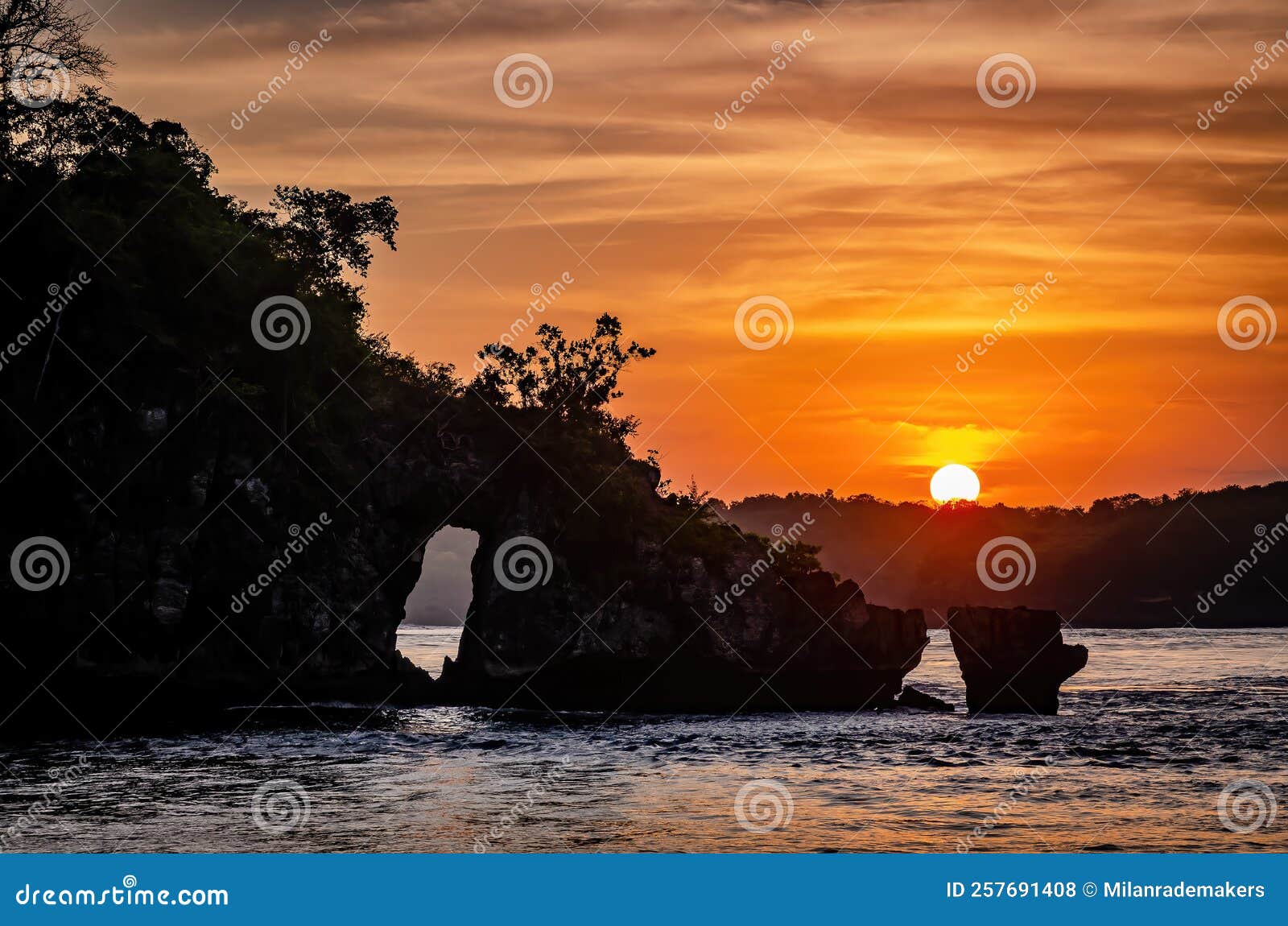 Sun Setting Behind the Horizon. Ocean Landscape with Sunset Stock Photo ...