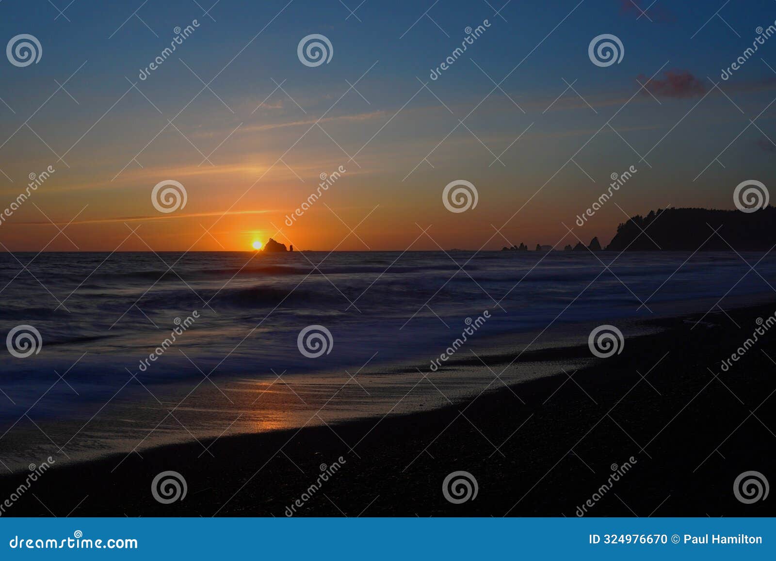 Sun Setting Behind a Sea Stack at Rialto Beach Stock Photo - Image of ...