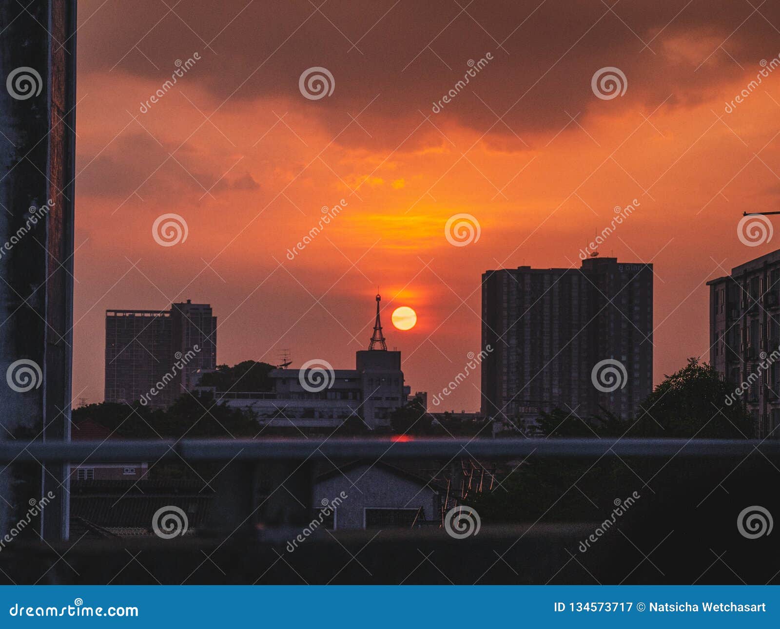The Sun Setting in City Over Buildings during Sunset Time Stock Image ...