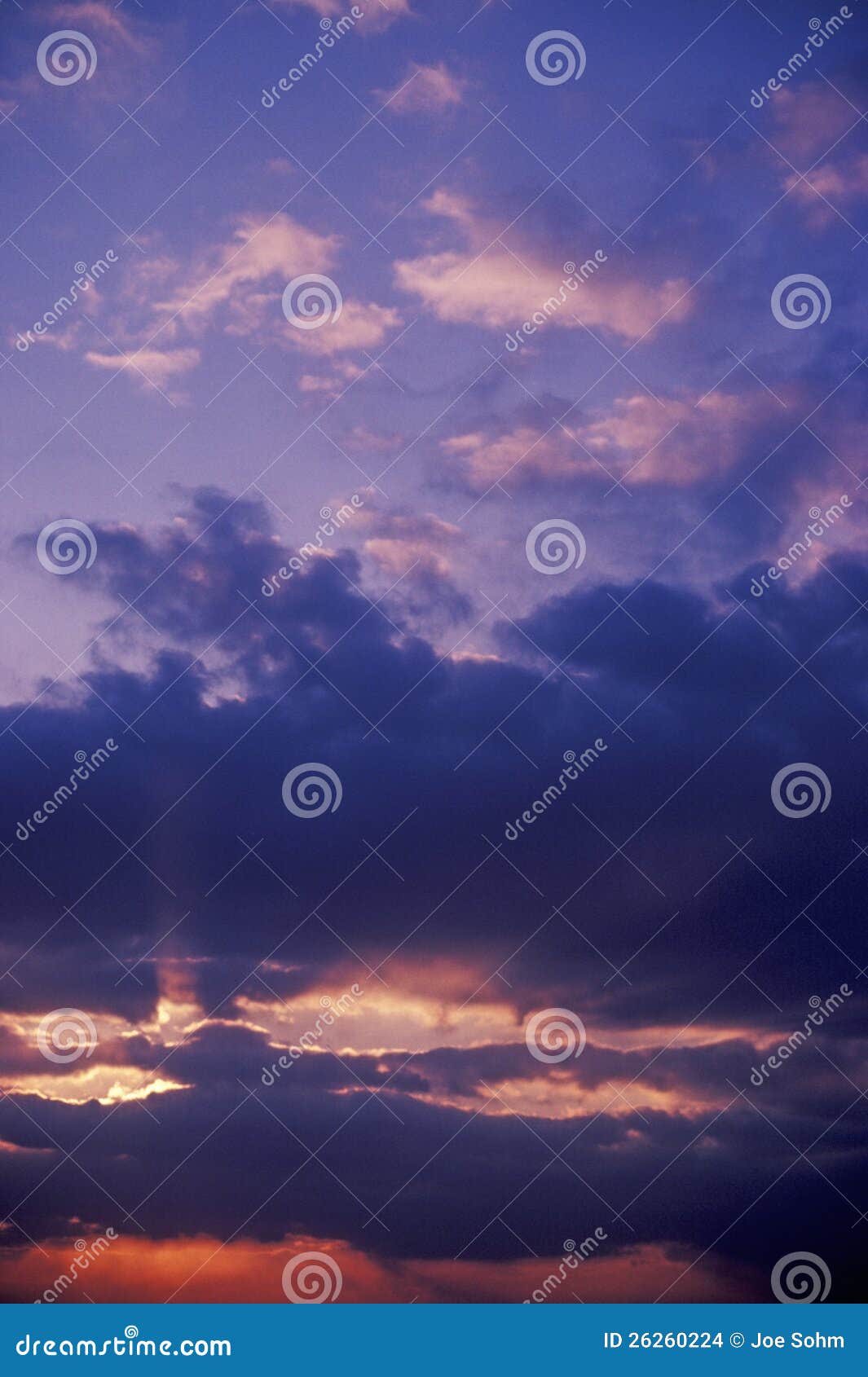 Sun Setting through Clouds stock photo. Image of sunset - 26260224