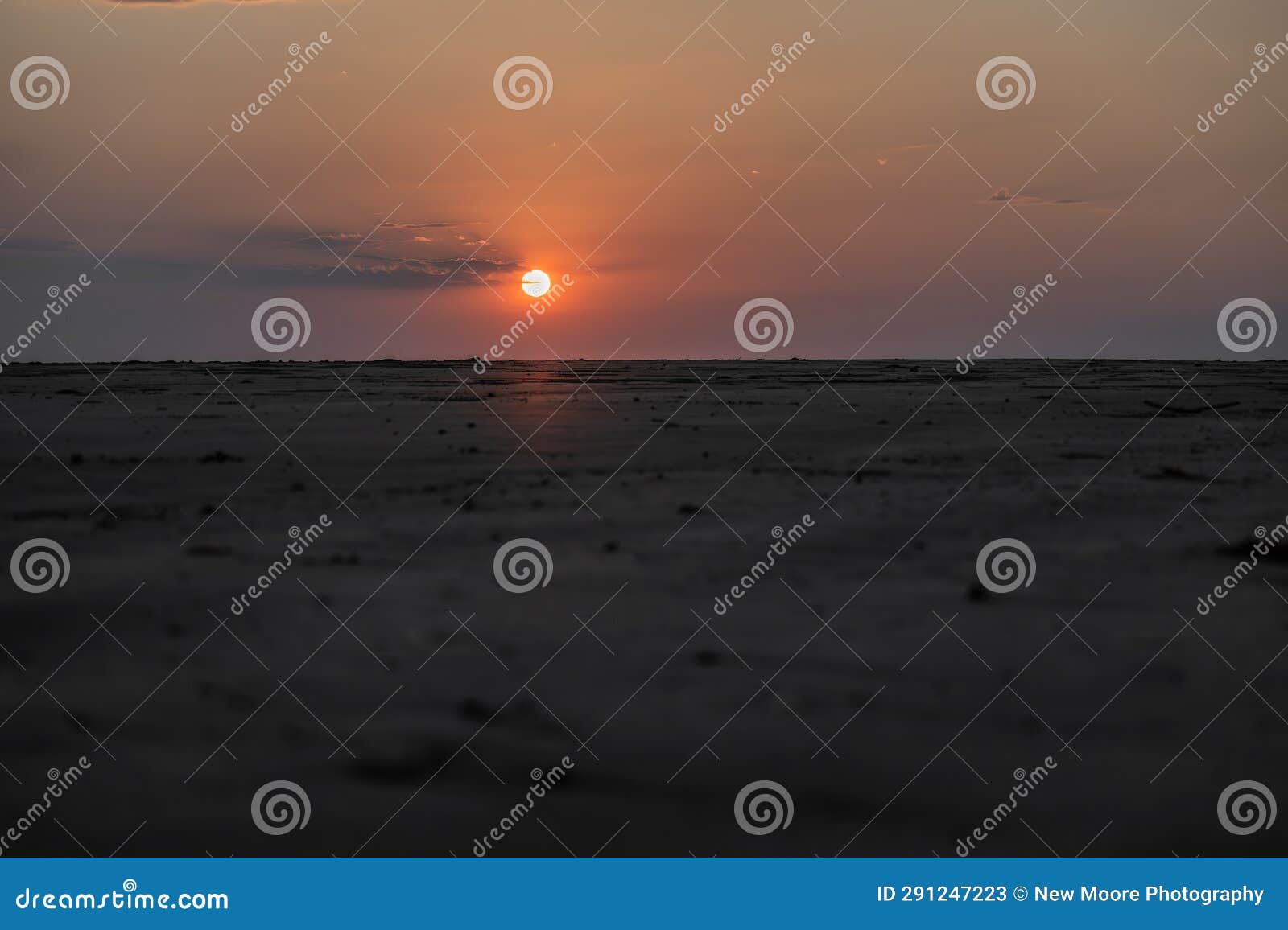 Sun Setting on the Horizon Behind a Sandy Beach Hill Stock Image ...