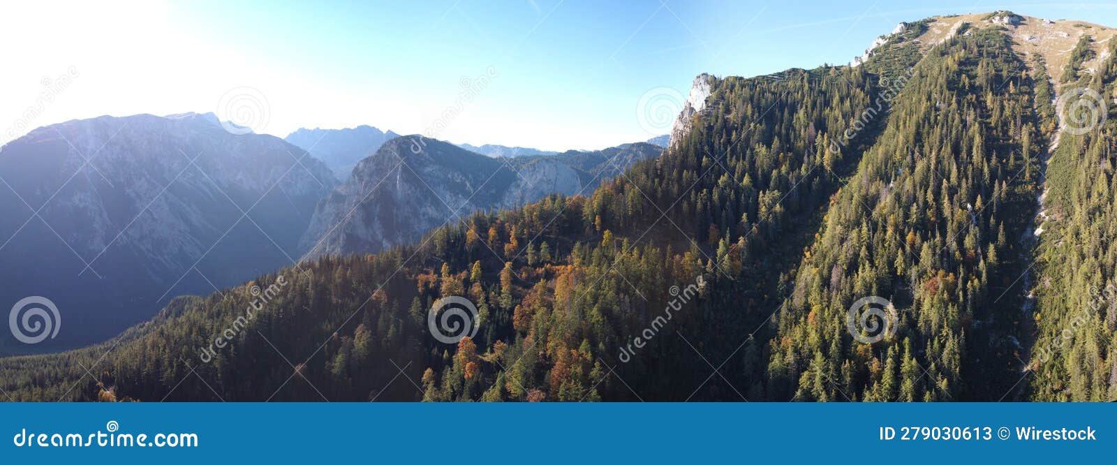 The Sun is Setting on the Mountain As it Rises Above Stock Image ...