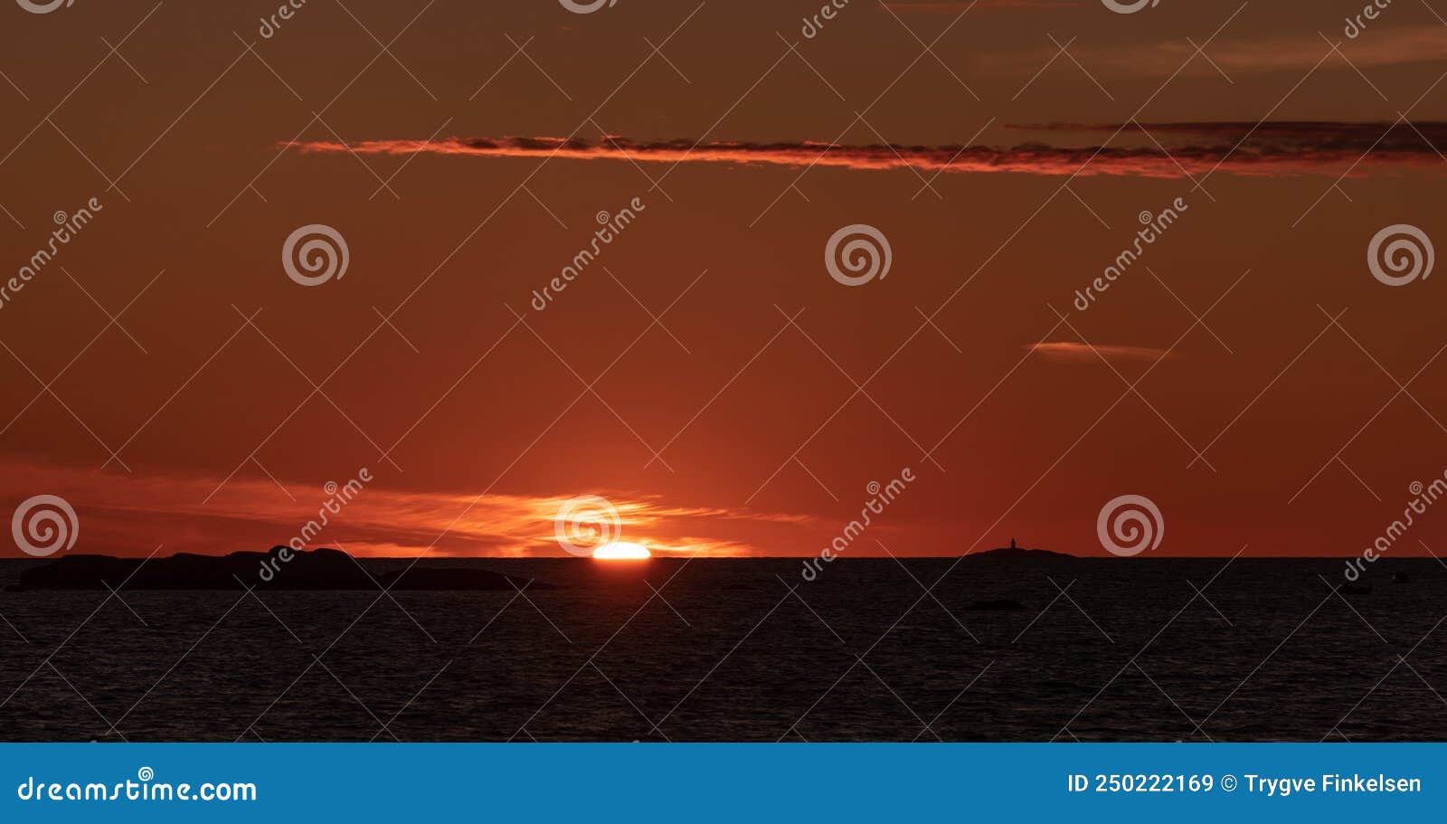 The Sun Setting in the Ocean with Small Islands and a Lighthouse in the ...