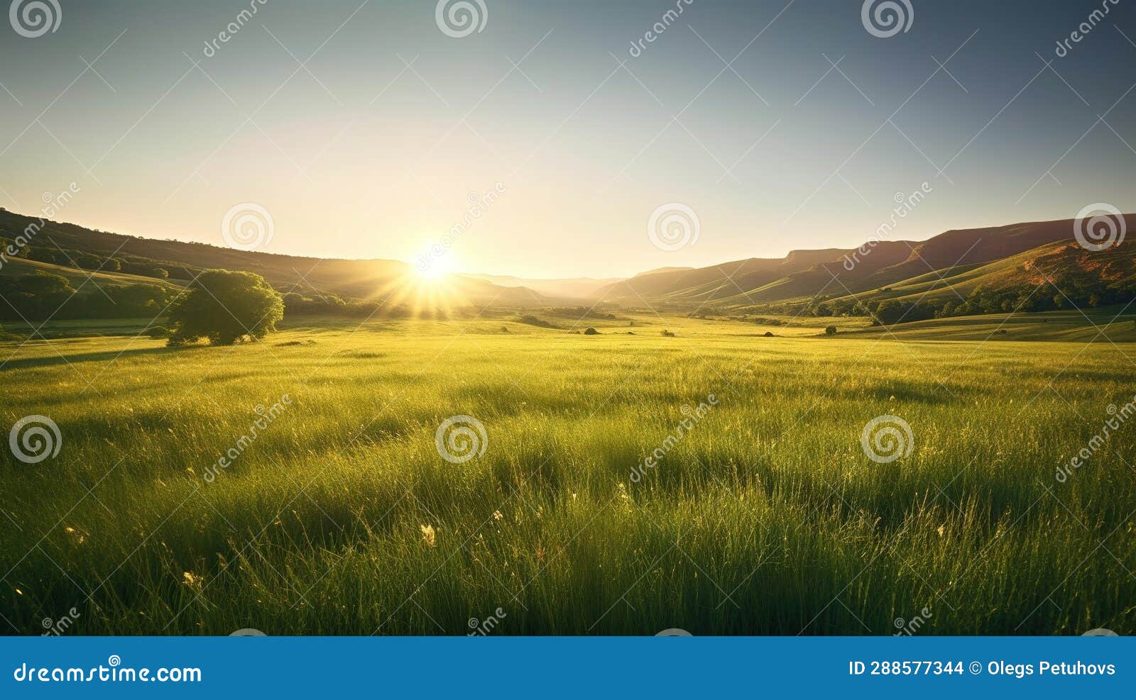 The Sun is Setting Over a Green Field with Mountains in the Background ...
