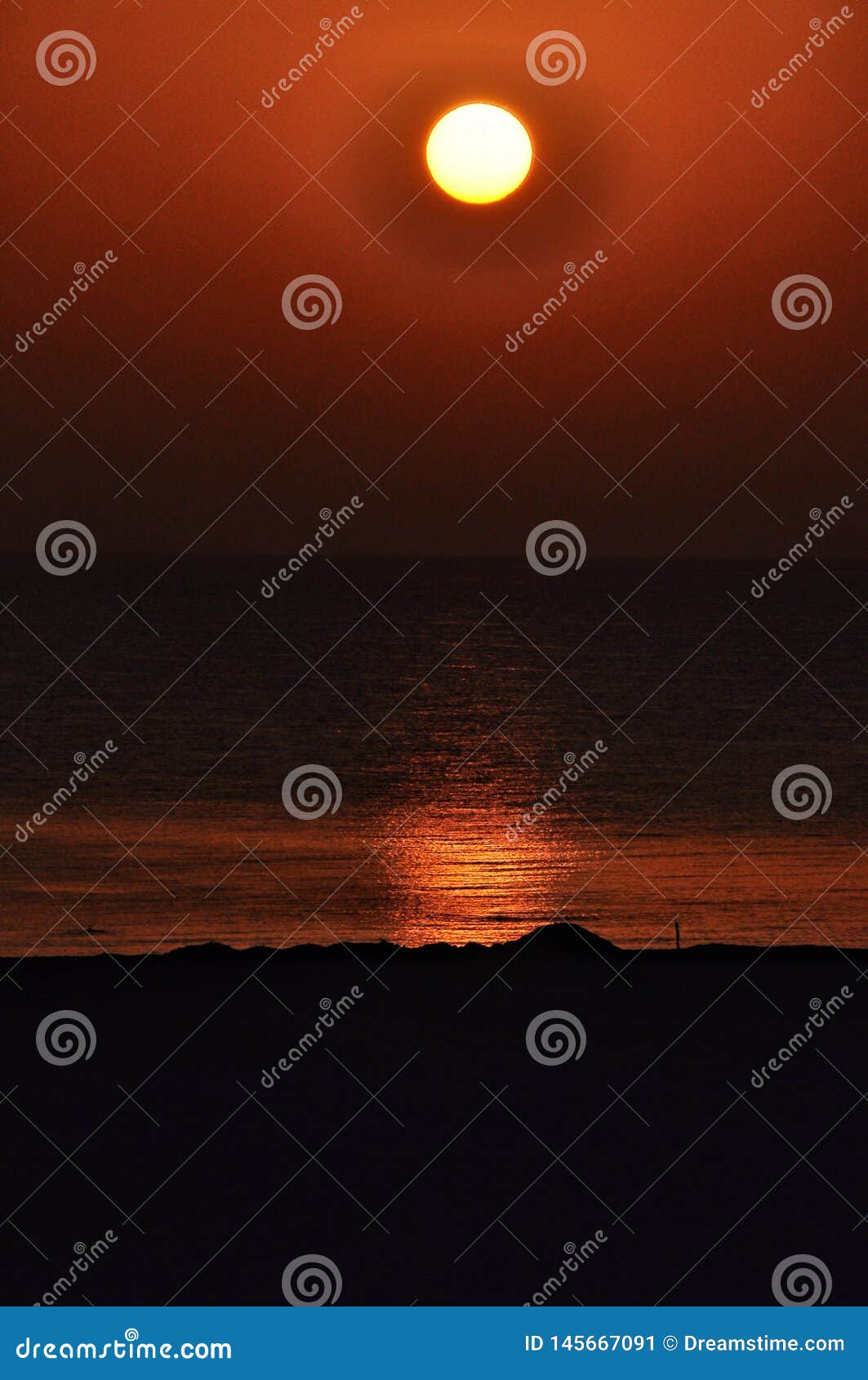 Sun Setting Over the Horizon of the Sea Stock Image - Image of black ...