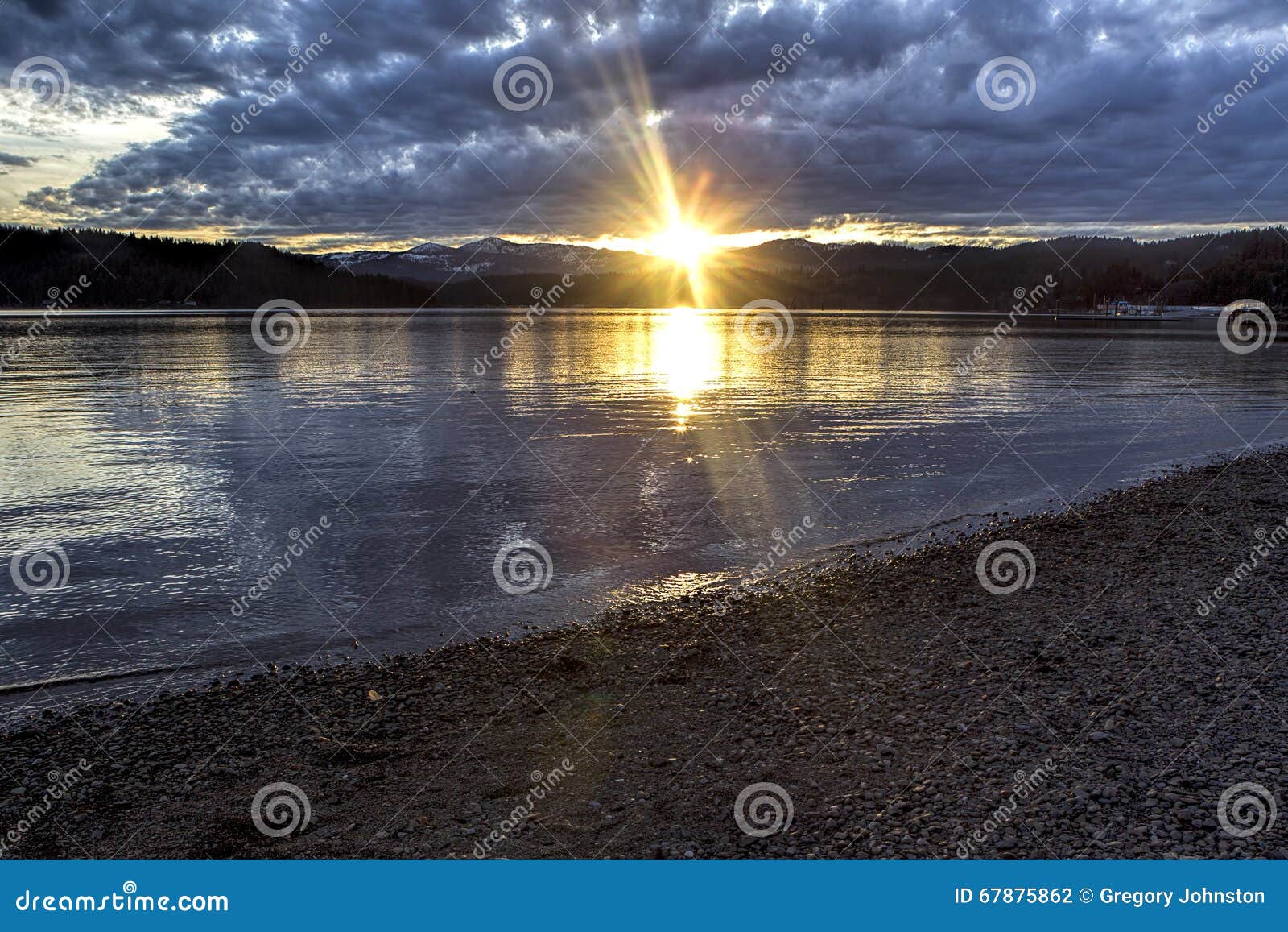 Sun setting over the lake. stock photo. Image of beach - 67875862