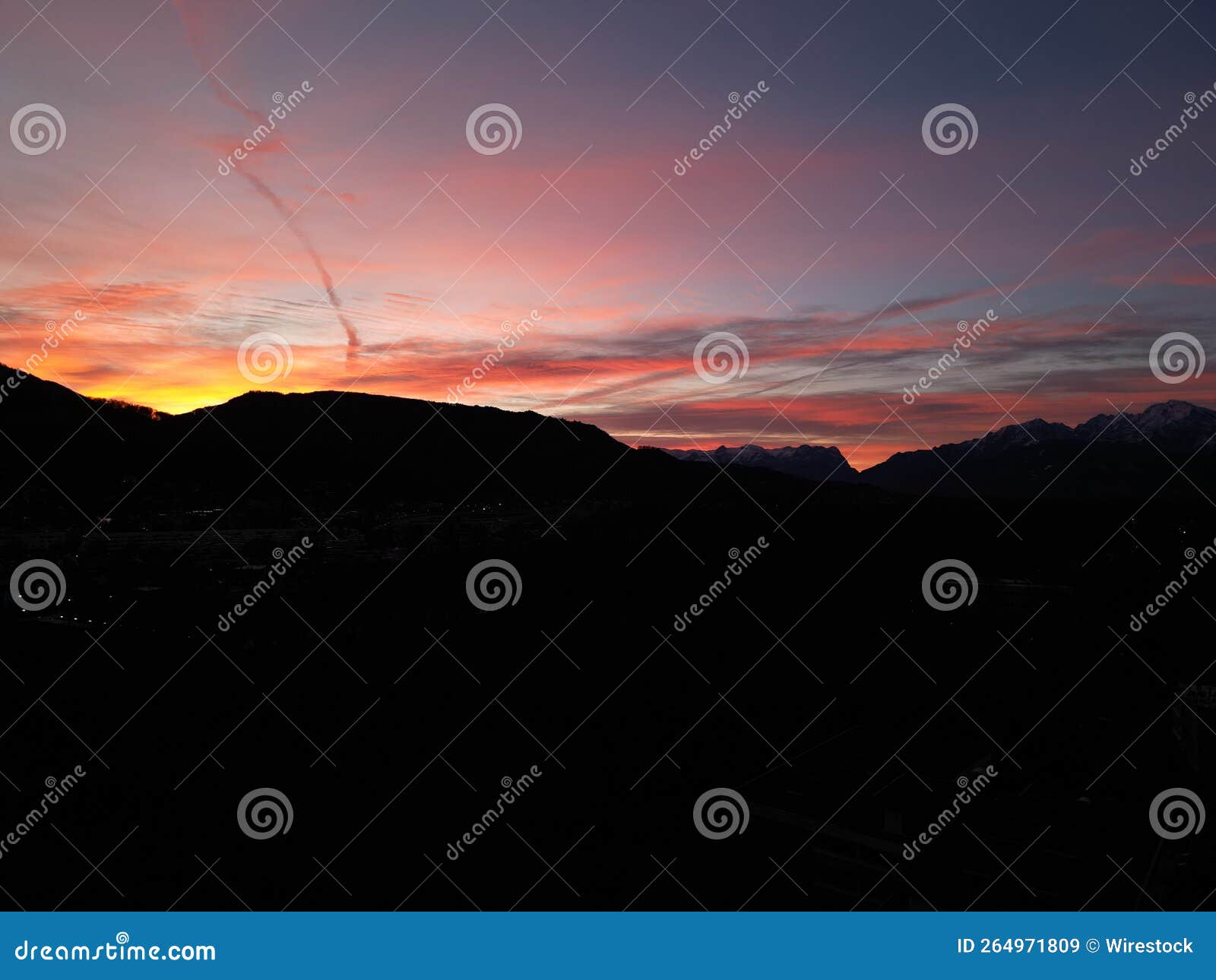 Sun Setting Over a Mountain Range in the Distance Stock Image - Image ...