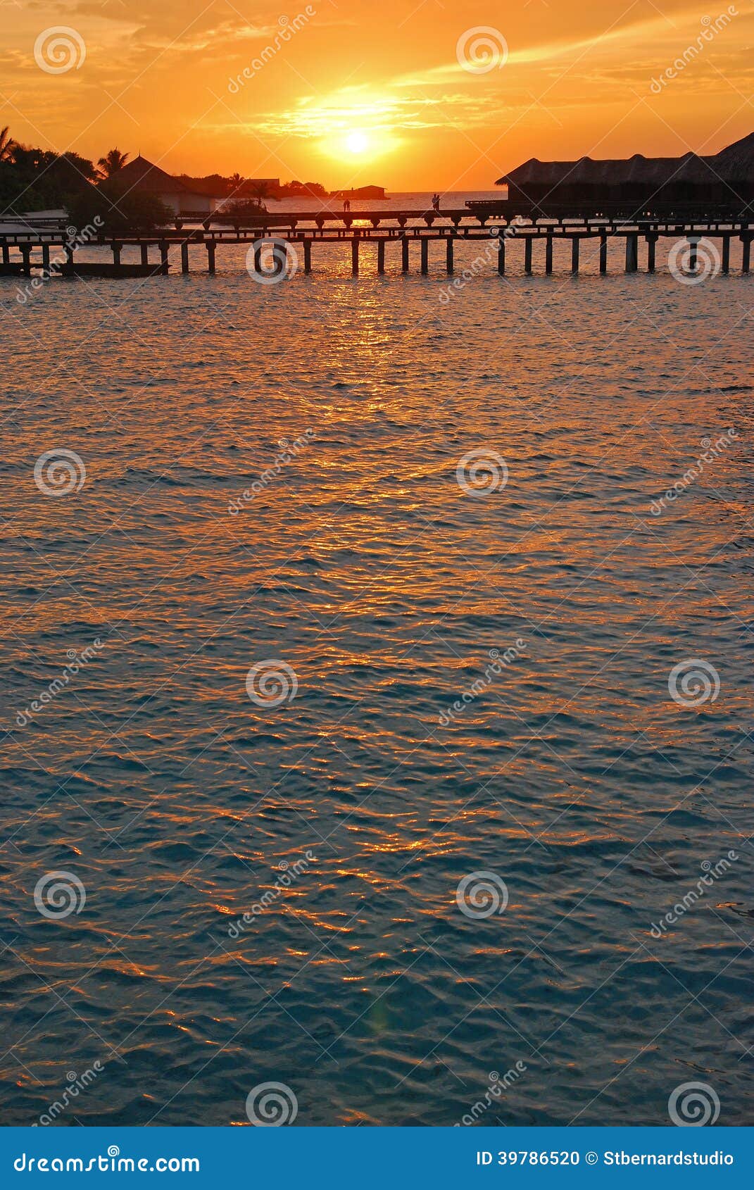 Sun Setting Over Overwater Villa at a Resort Island, Maldives Stock ...