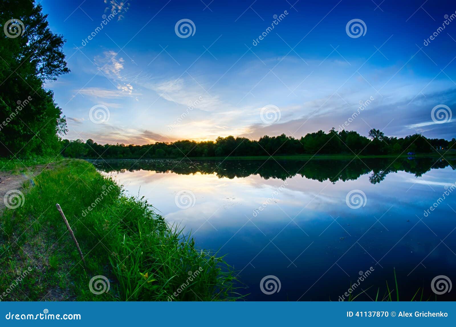 Sun Setting Over a Reflective Lake Stock Photo - Image of vista, duck ...