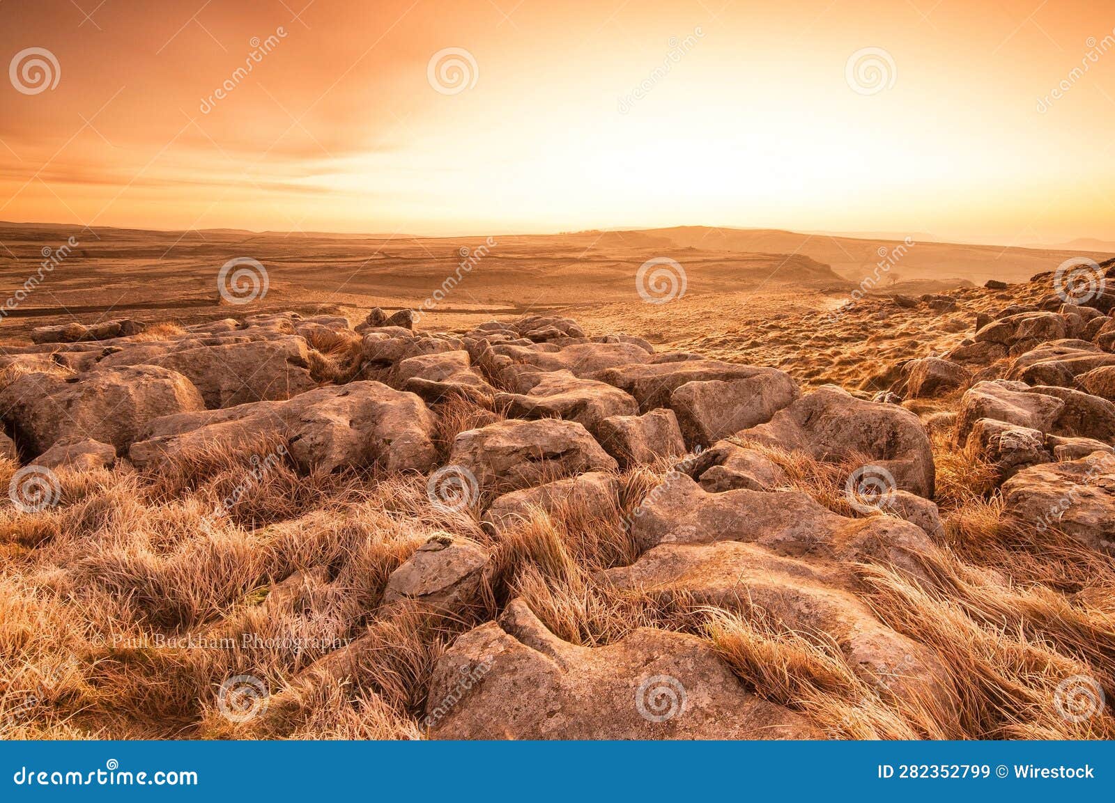A Sun Setting Over a Rocky Landscape in the Middle of Nowhere Stock ...