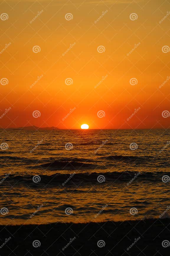 Sun setting over the sea stock image. Image of dusk - 331386633