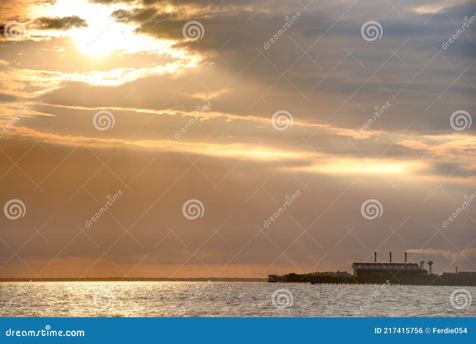 Sun Setting Over the Sea stock photo. Image of high - 217415756