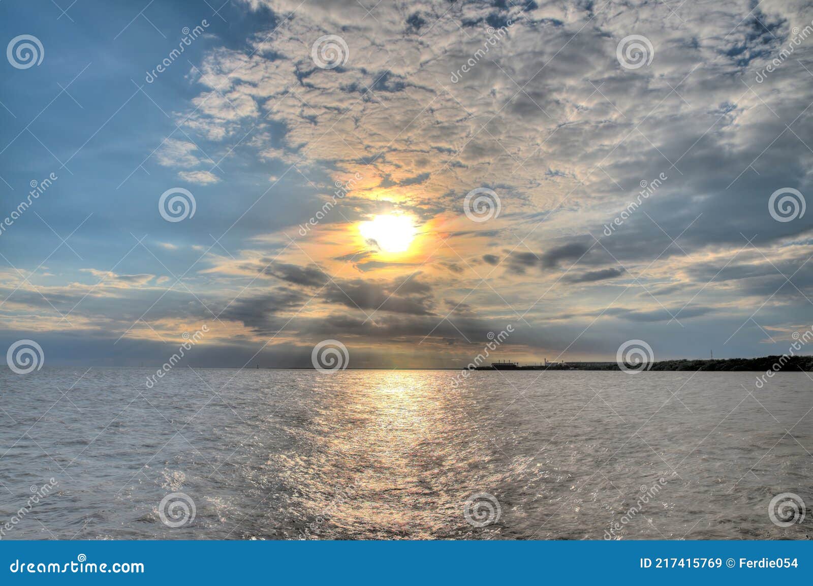 Sun Setting Over the Sea stock image. Image of coastline - 217415769