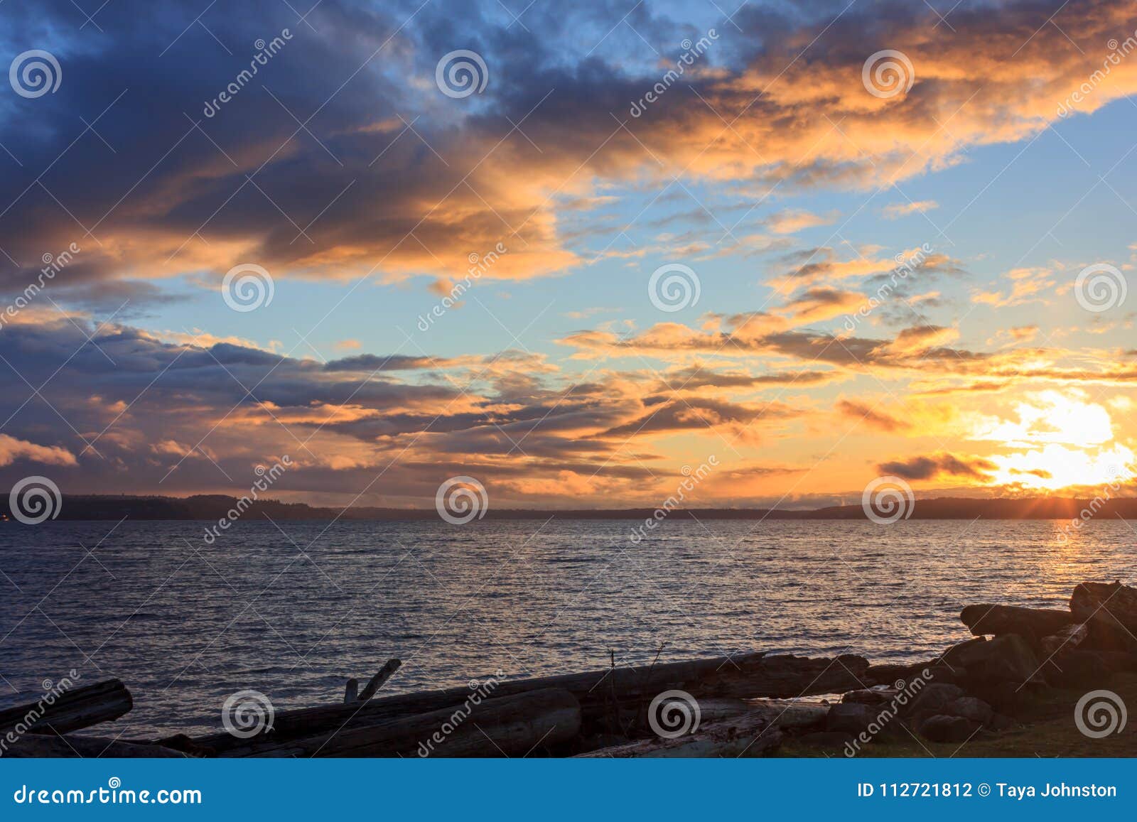 Sun setting over water stock photo. Image of dawn, bright - 112721812