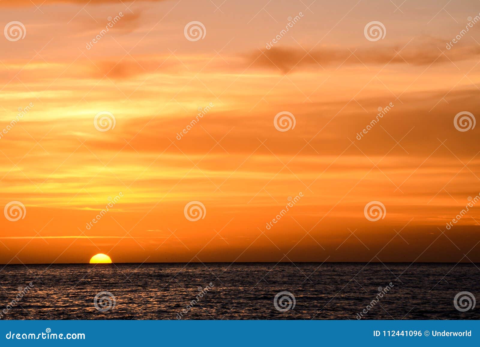 The Sun Setting in the Sea stock photo. Image of west - 112441096