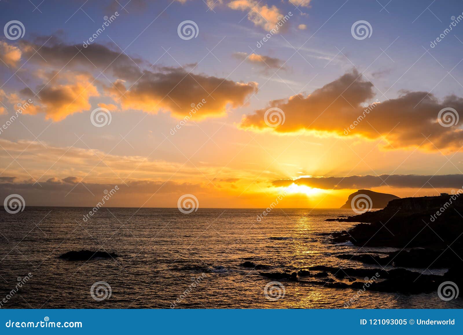 The Sun Setting in the Sea stock image. Image of heaven - 121093005
