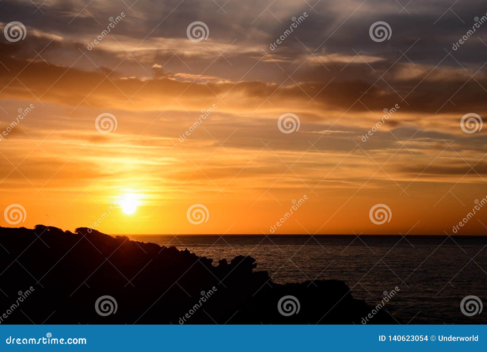 The Sun Setting in the Sea stock photo. Image of heaven - 140623054