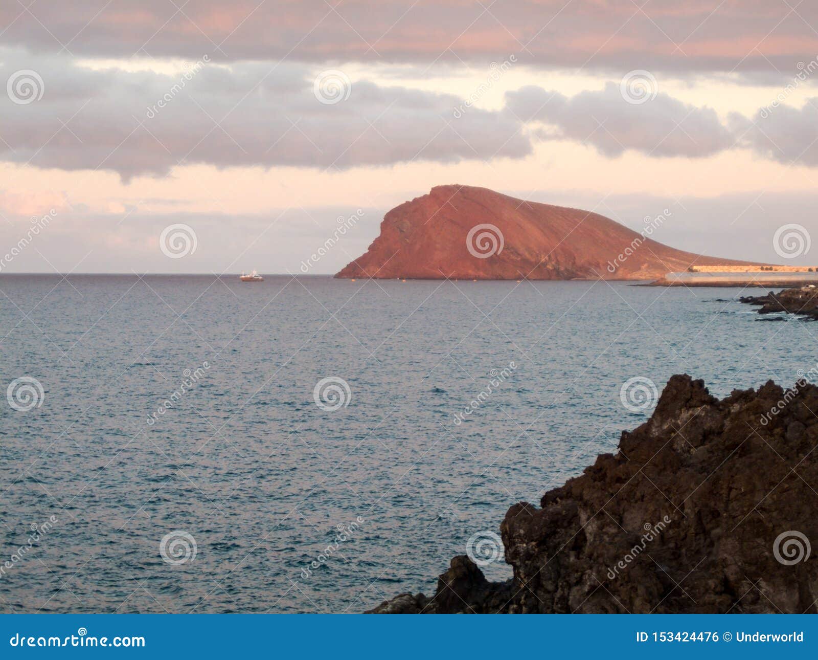 The Sun Setting in the Sea stock photo. Image of texture - 153424476