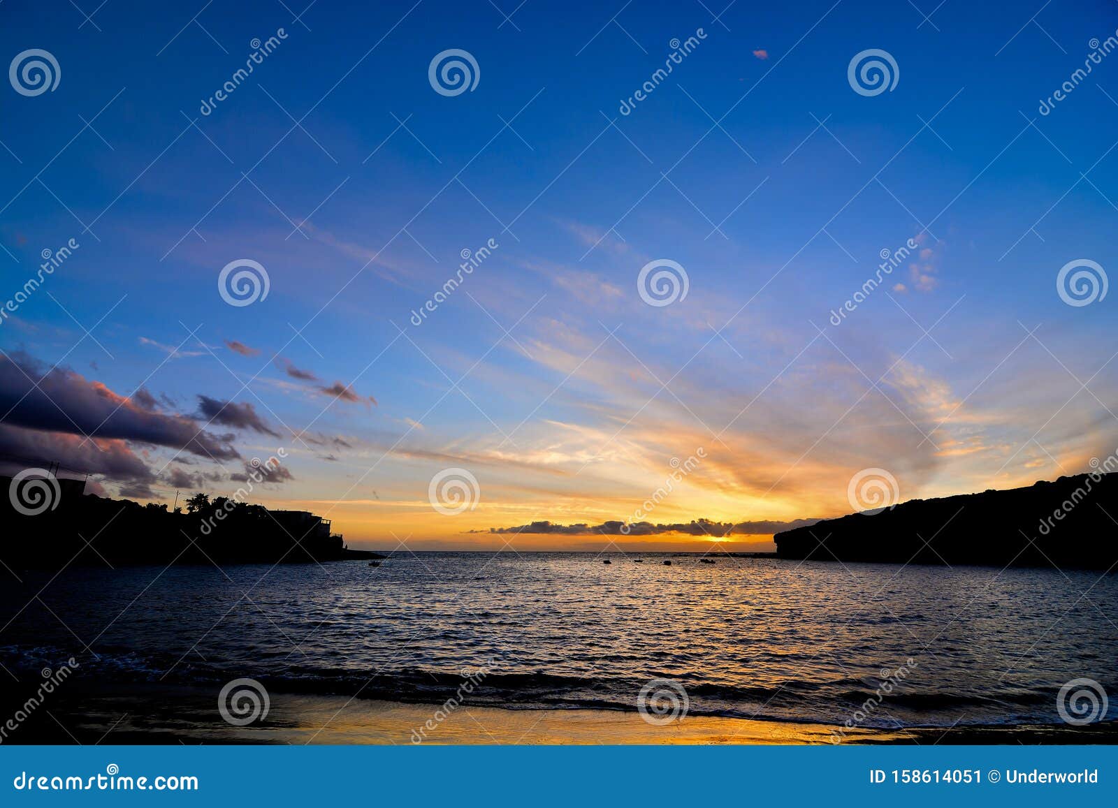 The Sun Setting in the Sea stock image. Image of time - 158614051